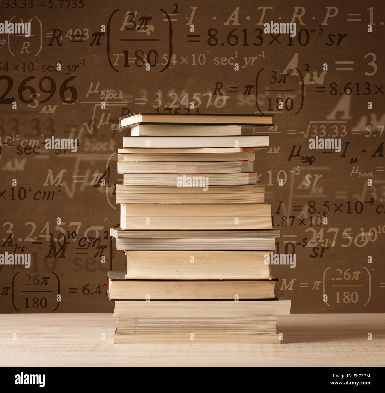 Books on vintage background with math formulas Stock Photo - Alamy