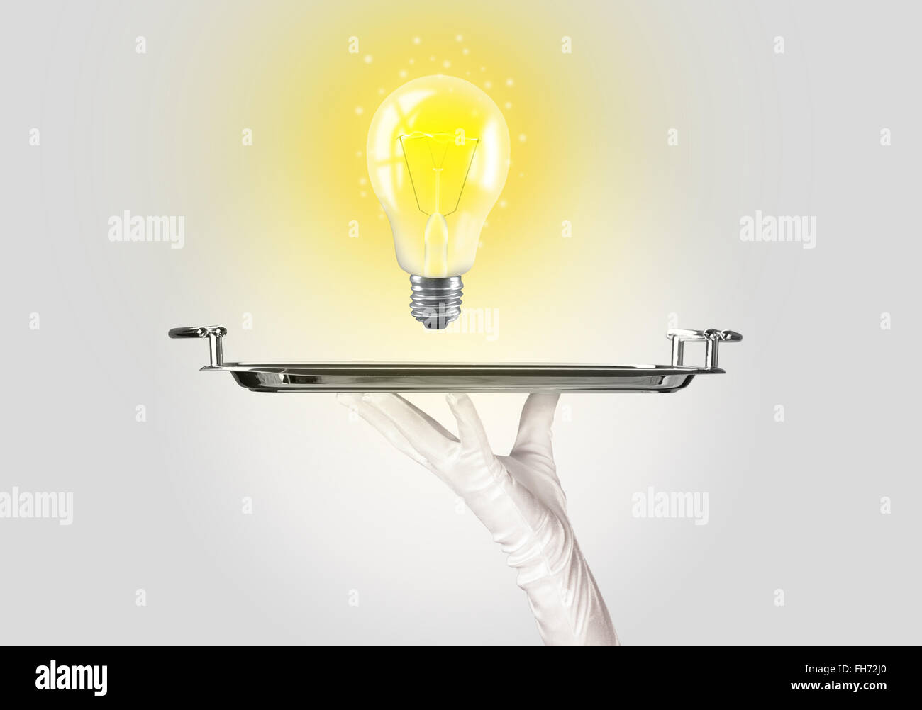 Clever idea concept with bulb on tray Stock Photo - Alamy