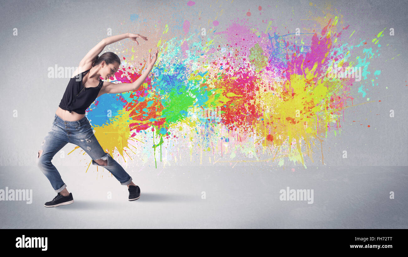 Young colorful street dancer with paint splash Stock Photo - Alamy