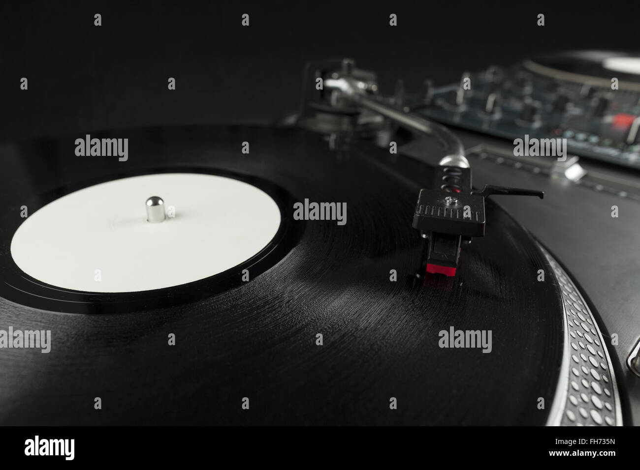 Turntable playing vinyl close up with needle on the record Stock Photo ...