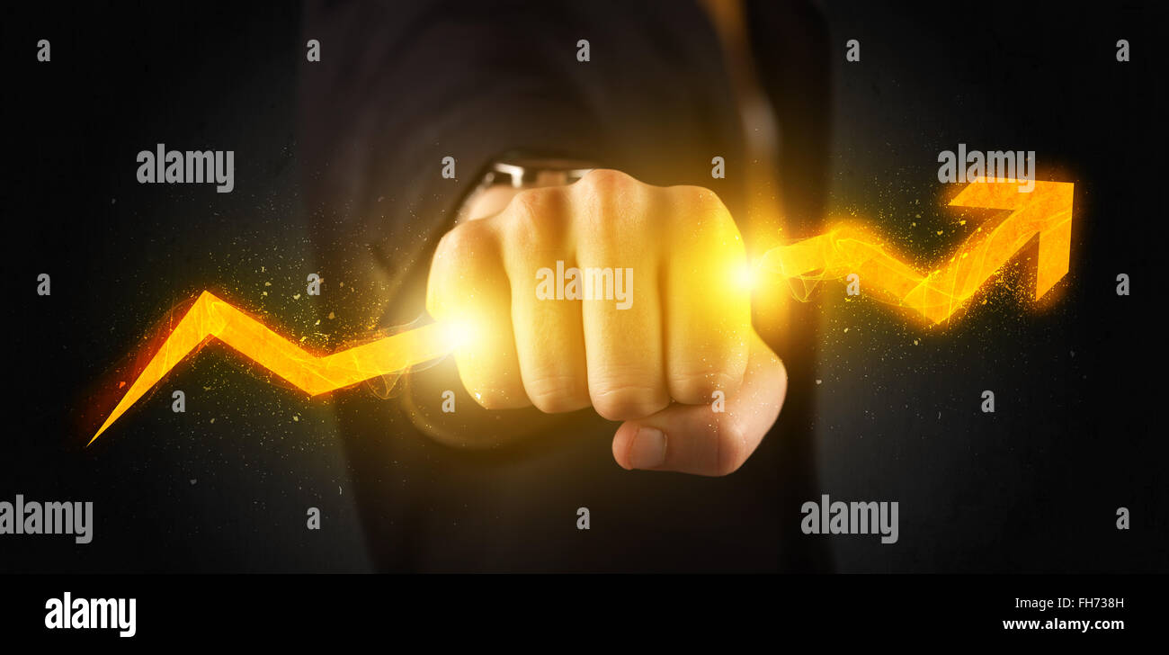 Business person holding a hot glowing upright arrow Stock Photo - Alamy