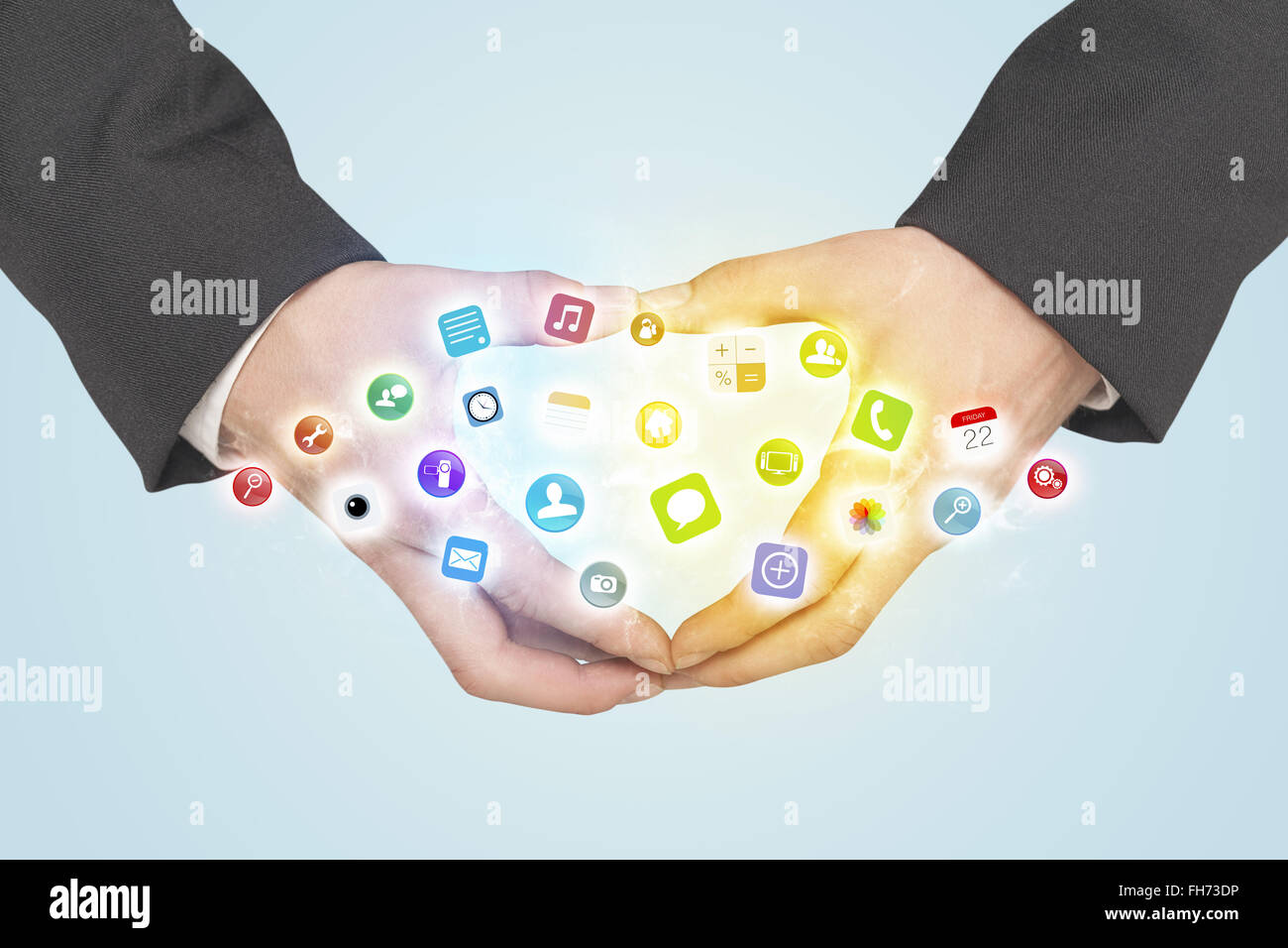 Hands creating a form with mobile app icons Stock Photo - Alamy