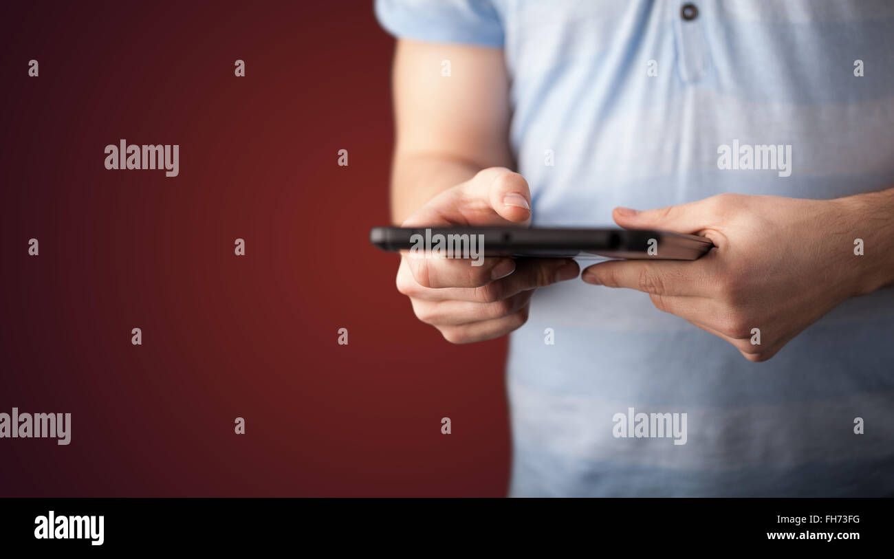 Close up of hand holding digital touchpad tablet device Stock Photo - Alamy