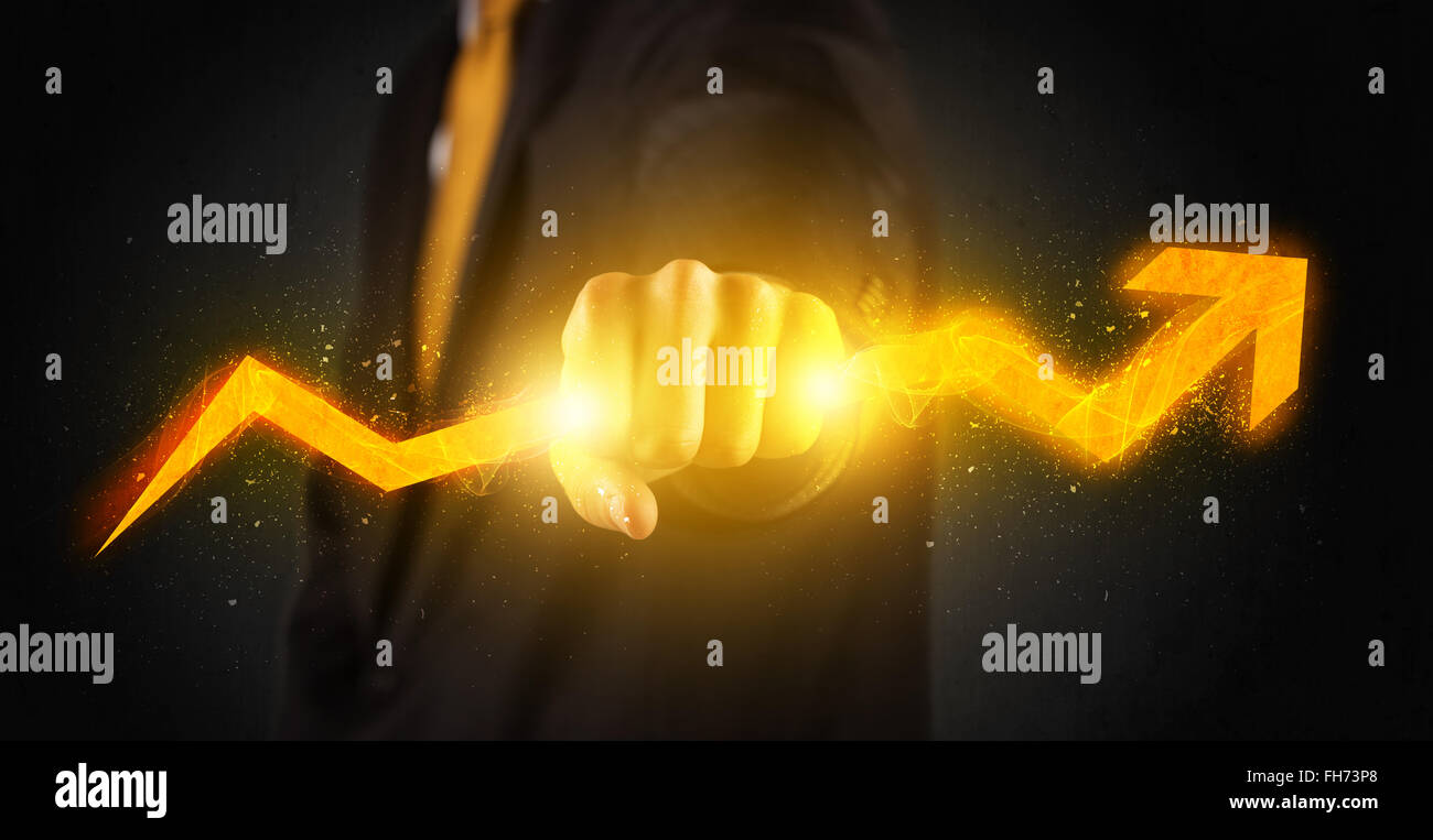 Business person holding a hot glowing upright arrow Stock Photo - Alamy