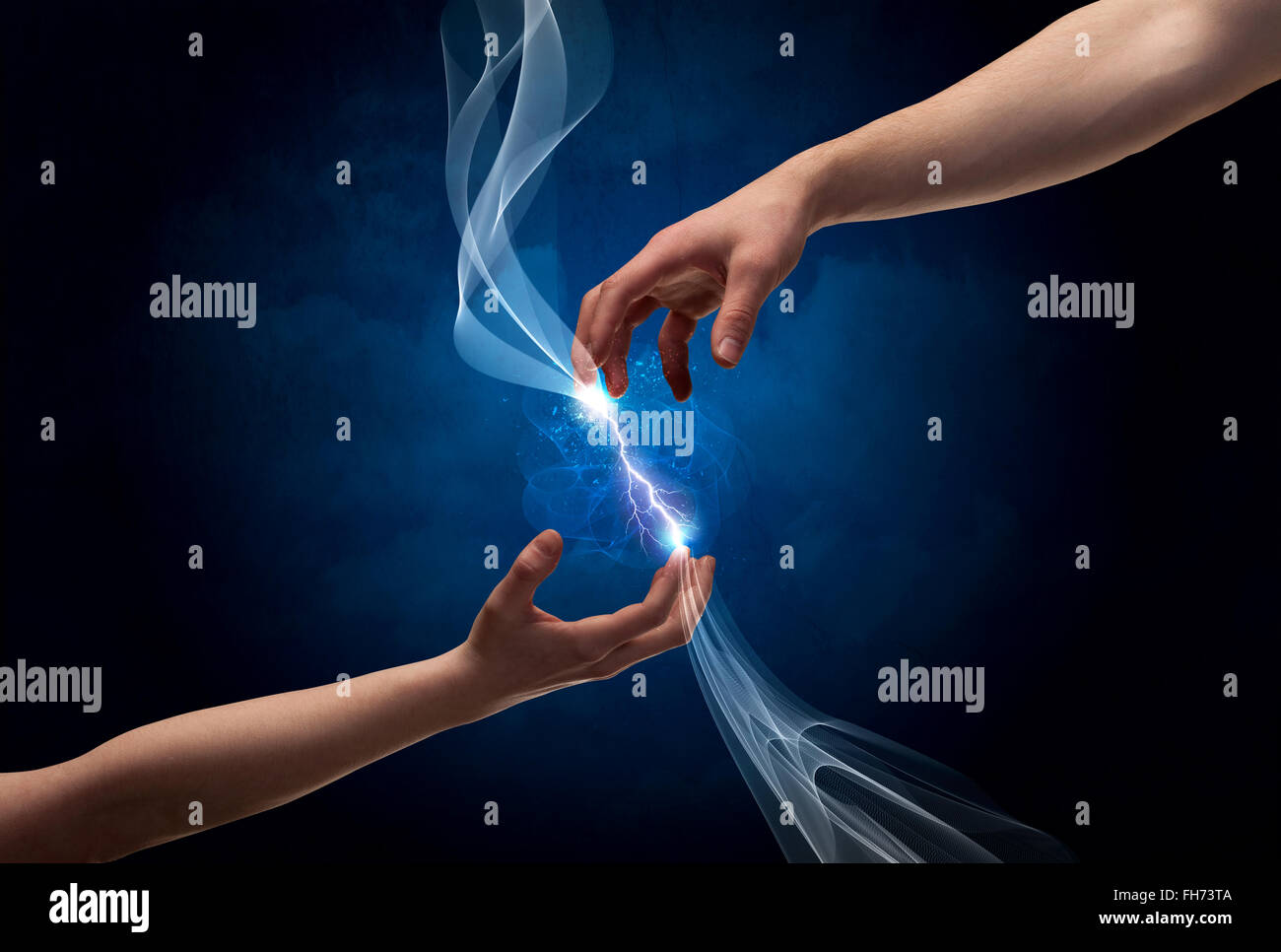 Hands connecting through fingers in space Stock Photo - Alamy