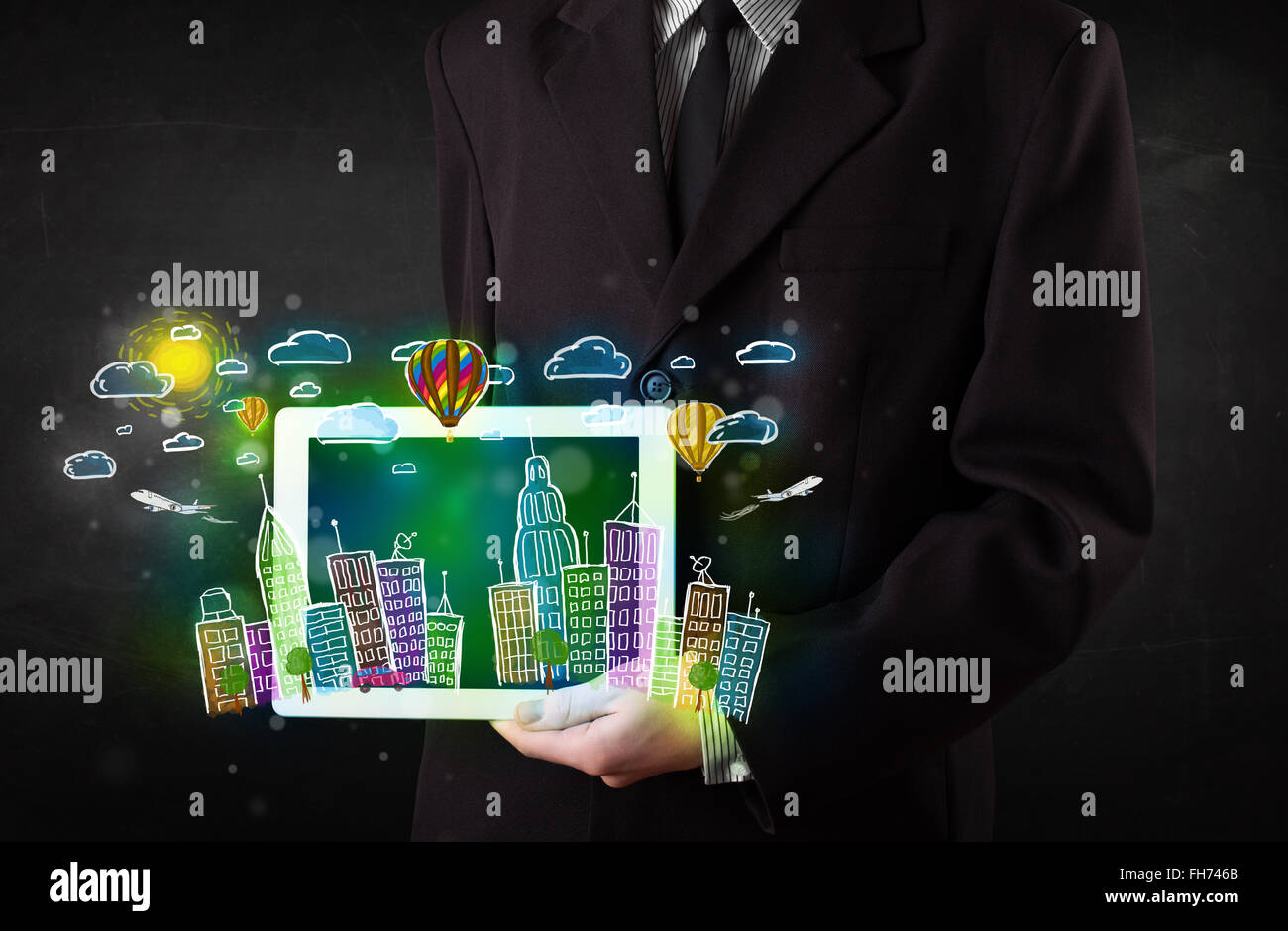Young person showing tablet with hand drawn cityscape Stock Photo - Alamy