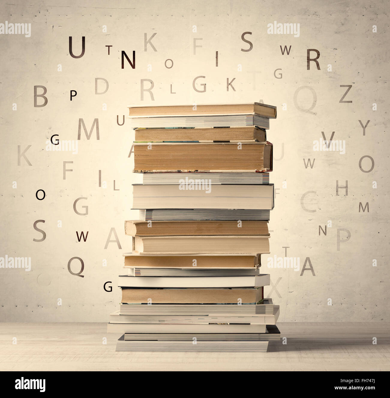 Books with flying letters on vintage background Stock Photo - Alamy