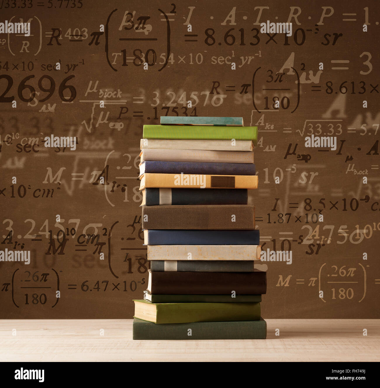Books on vintage background with math formulas Stock Photo - Alamy