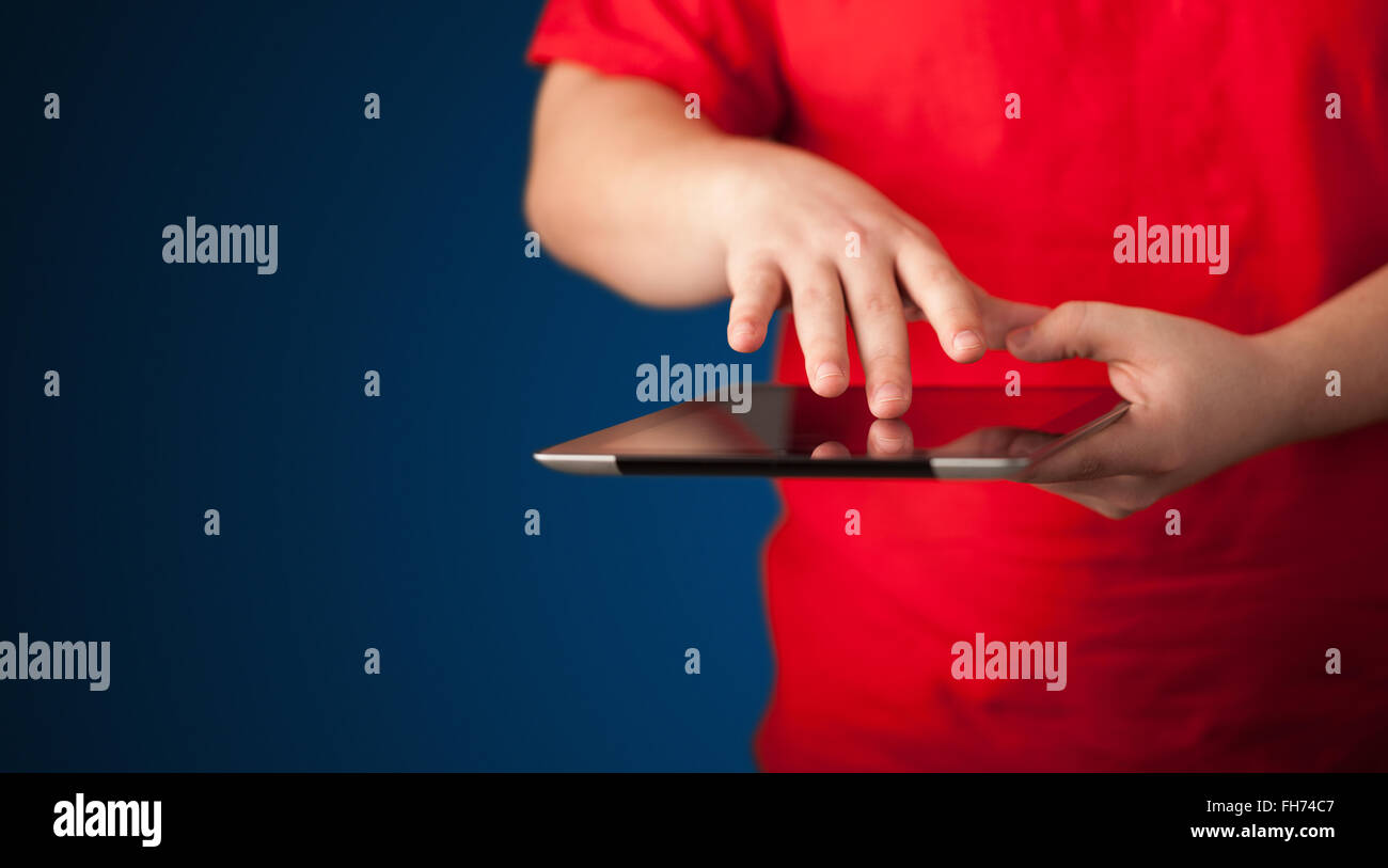 Close up of hand holding digital touchpad tablet device Stock Photo - Alamy