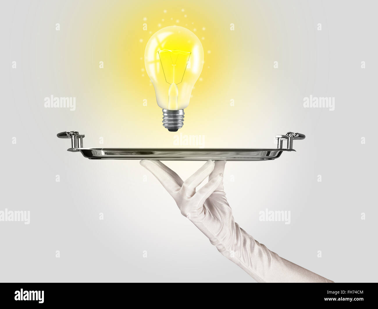 Clever idea concept with bulb on tray Stock Photo - Alamy