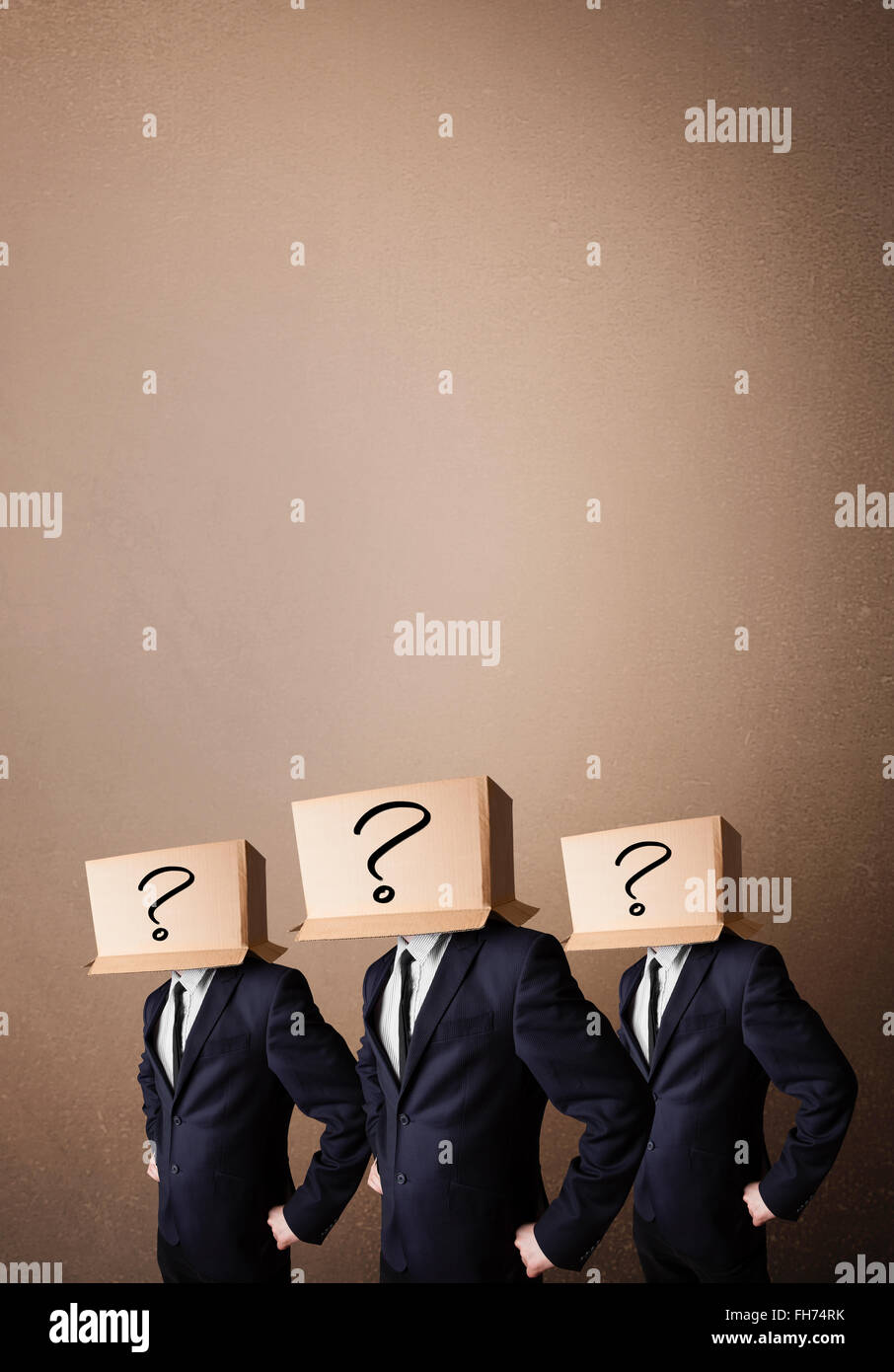 Handsome men in suit gesturing with drawn question marks on box Stock ...