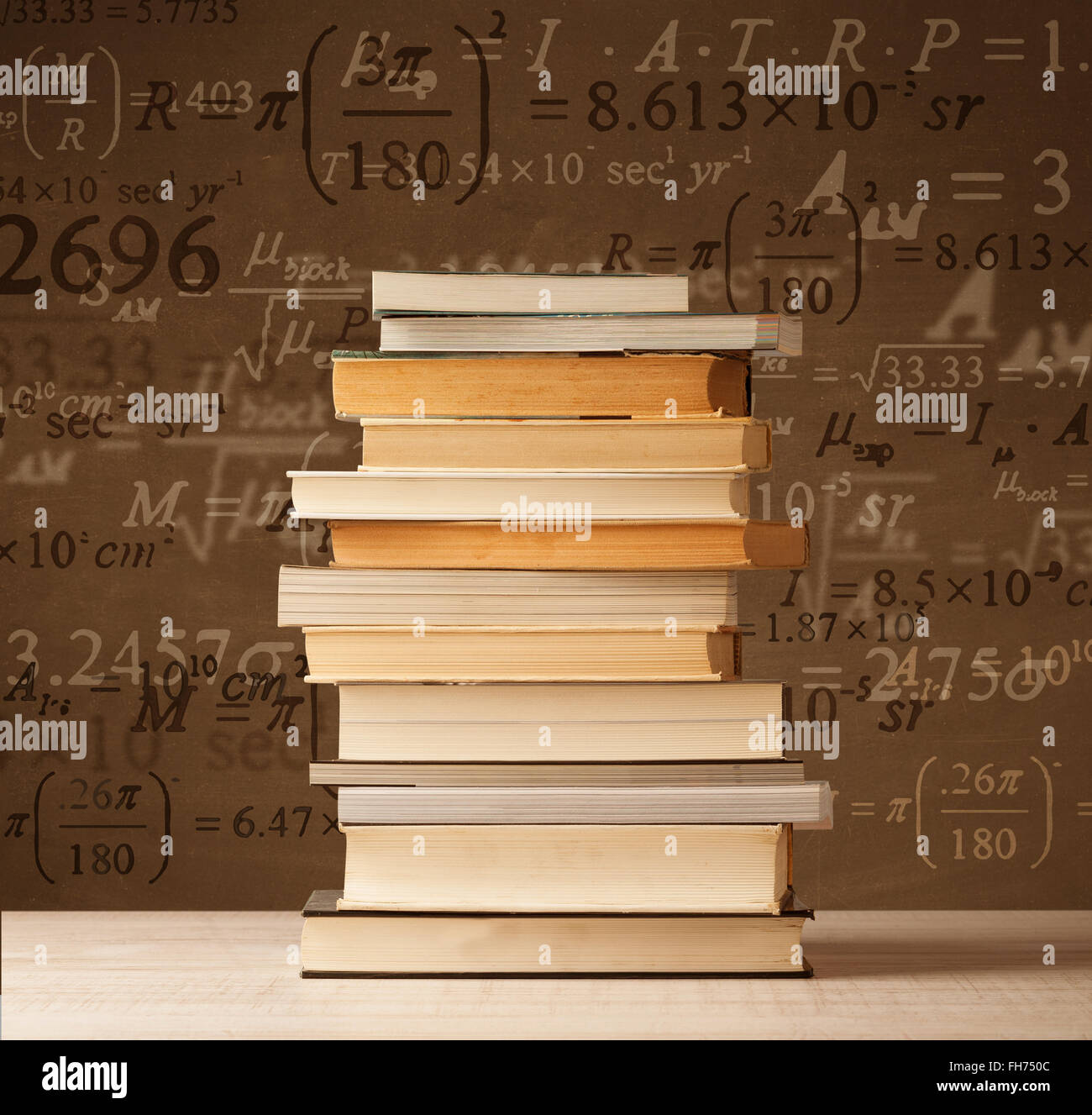 Books on vintage background with math formulas Stock Photo - Alamy