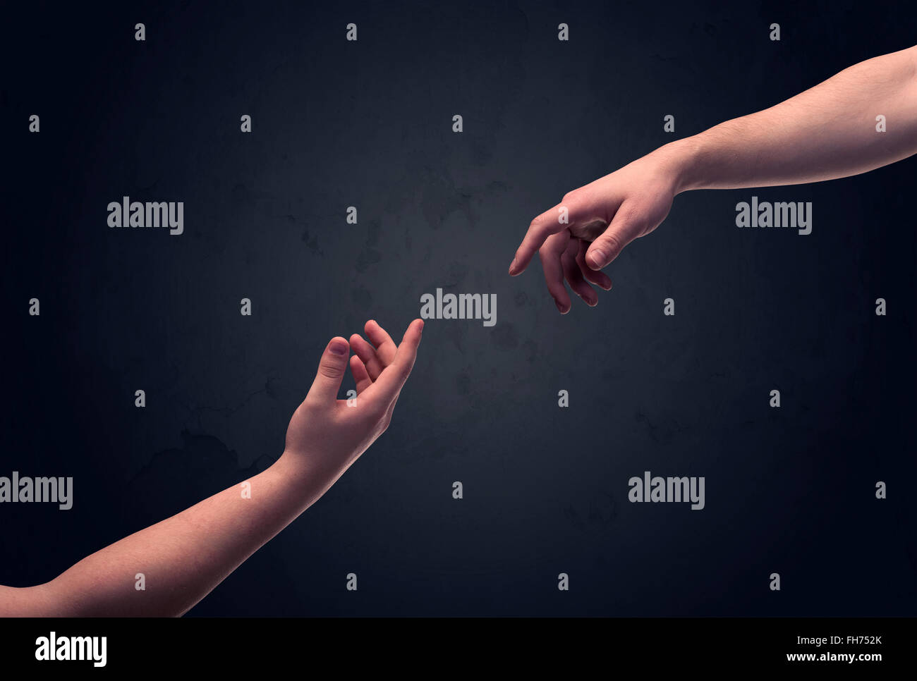 Hand about to touch another one Stock Photo - Alamy