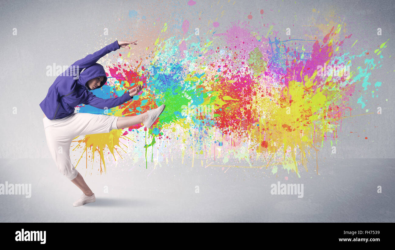 Young colorful street dancer with paint splash Stock Photo - Alamy