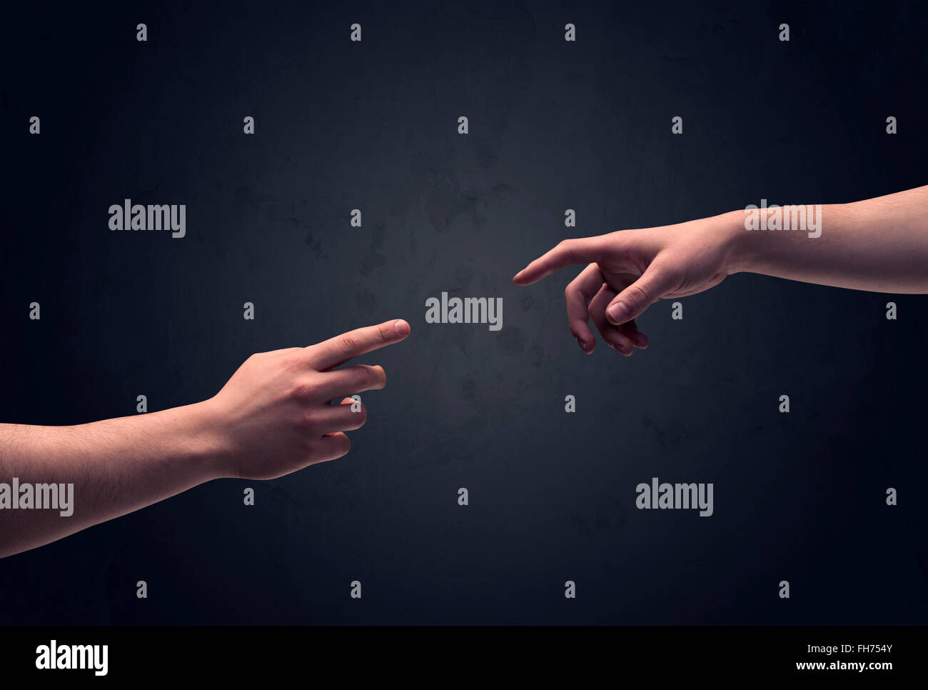 Hand about to touch another one Stock Photo - Alamy