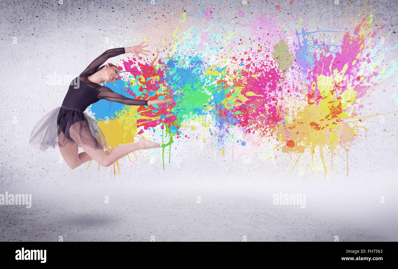 Modern street dancer jumping with colorful paint splashes Stock Photo ...