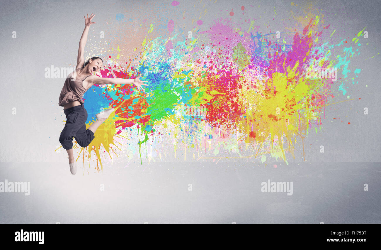 Young colorful street dancer with paint splash Stock Photo - Alamy
