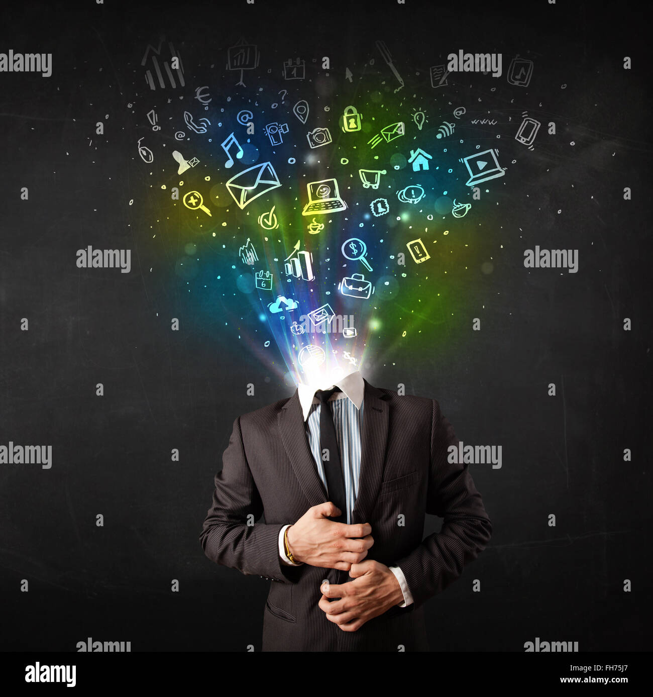 Business man with glowing media icons exploding head Stock Photo - Alamy