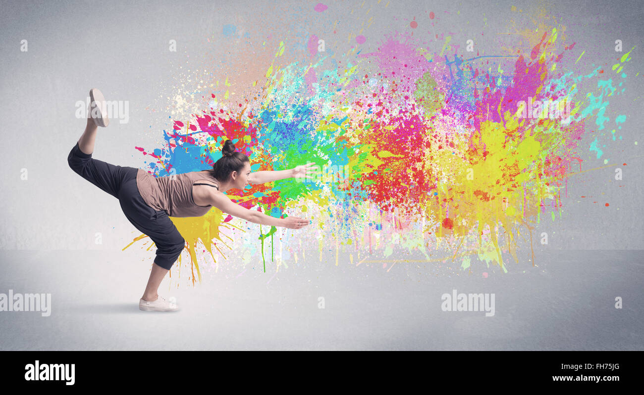 Young colorful street dancer with paint splash Stock Photo - Alamy