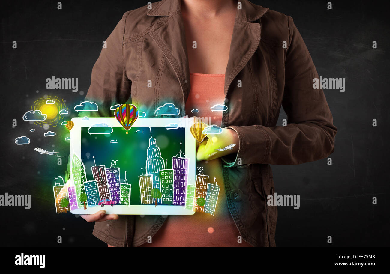 Young person showing tablet with hand drawn cityscape Stock Photo - Alamy