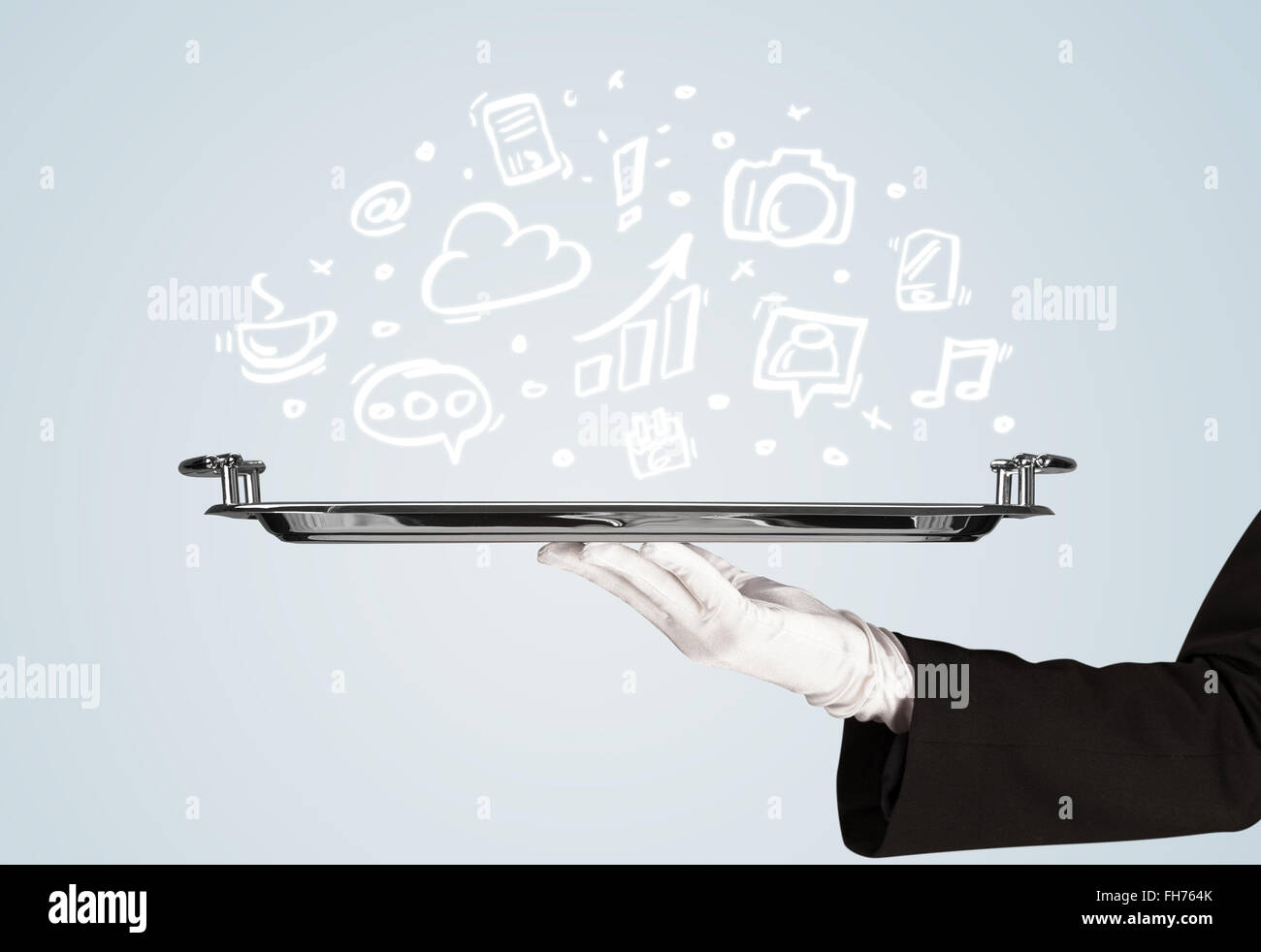 Waiter holding tray with media icons Stock Photo - Alamy