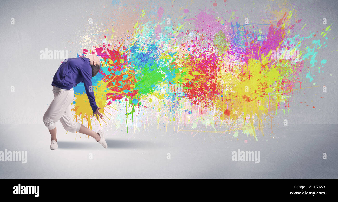 Young colorful street dancer with paint splash Stock Photo - Alamy