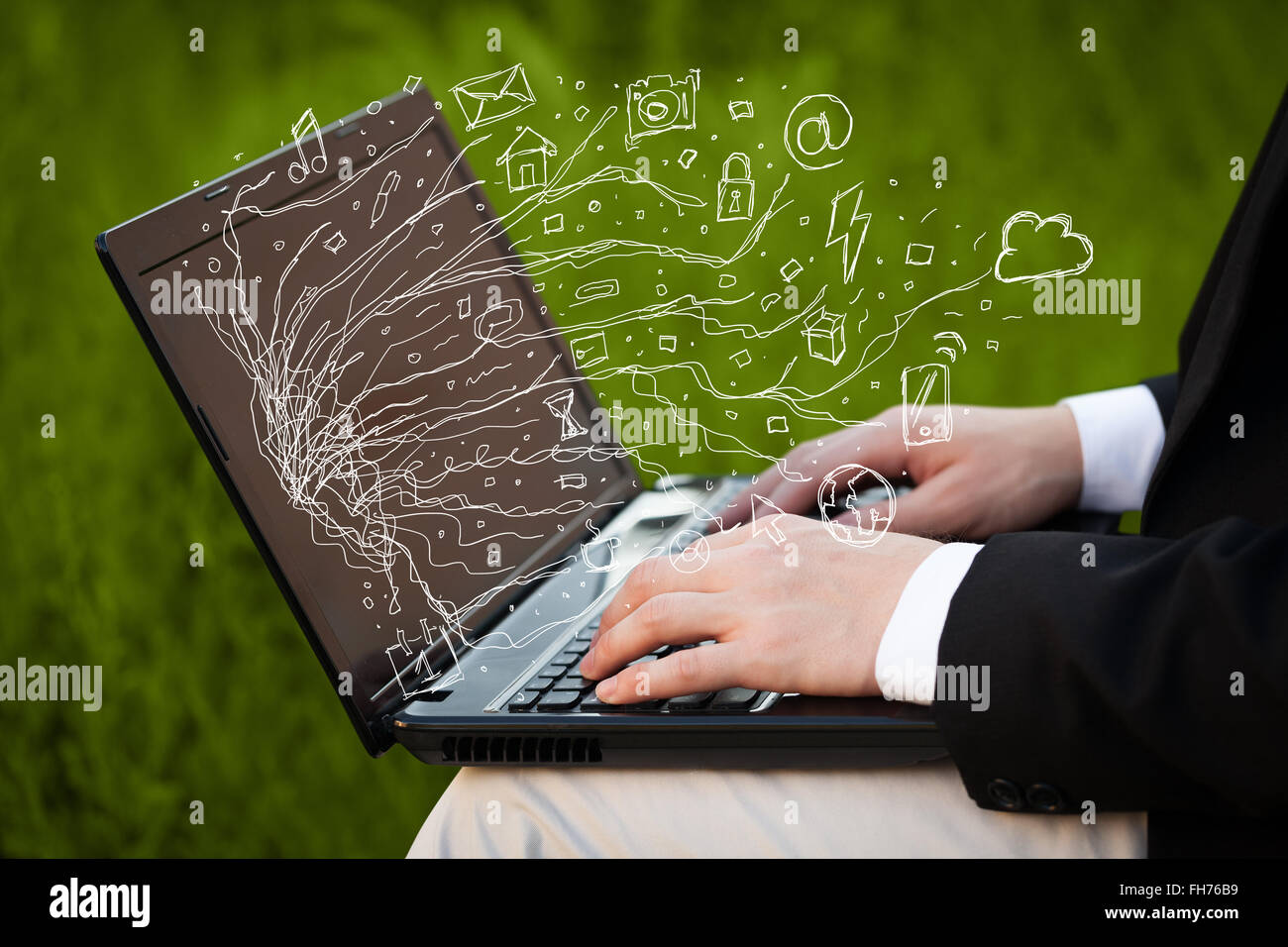Man pressing notebook laptop computer with doodle icon cloud symbols ...