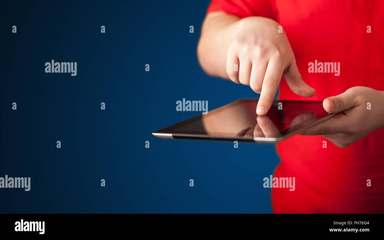 Close up of hand holding digital touchpad tablet device Stock Photo - Alamy