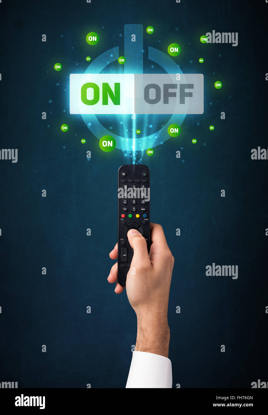Hand with remote control and on-off signals Stock Photo - Alamy
