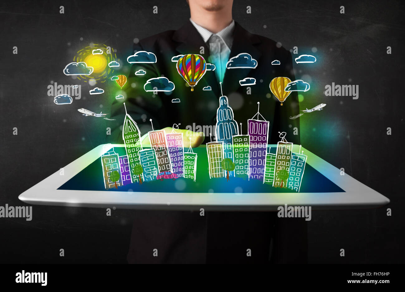 Young person showing tablet with hand drawn cityscape Stock Photo - Alamy