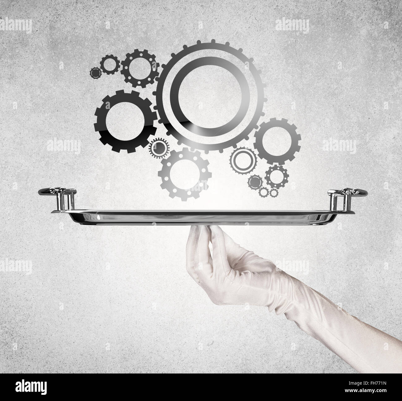 Working cog wheel concept on tray Stock Photo - Alamy