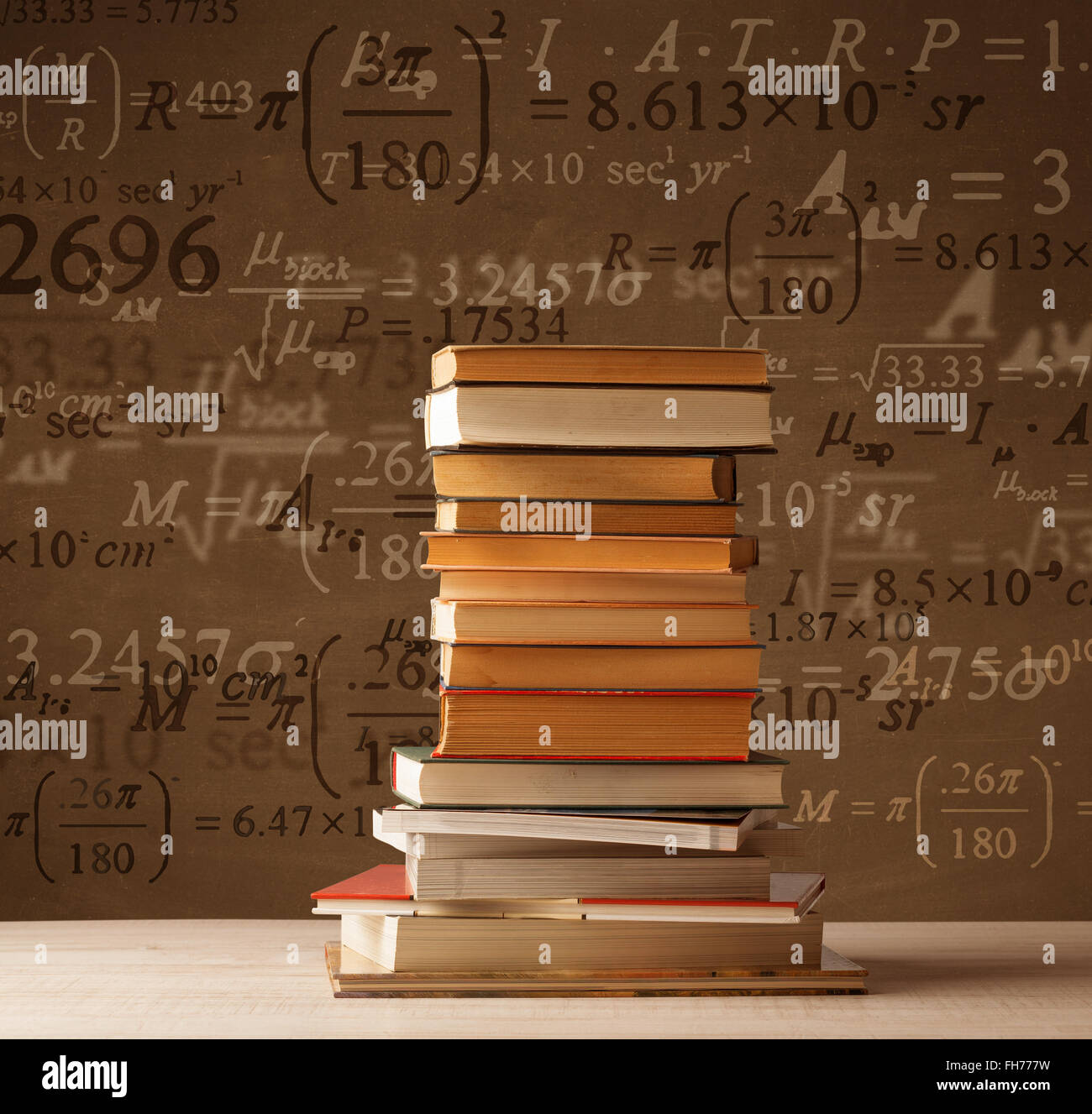 Books on vintage background with math formulas Stock Photo - Alamy