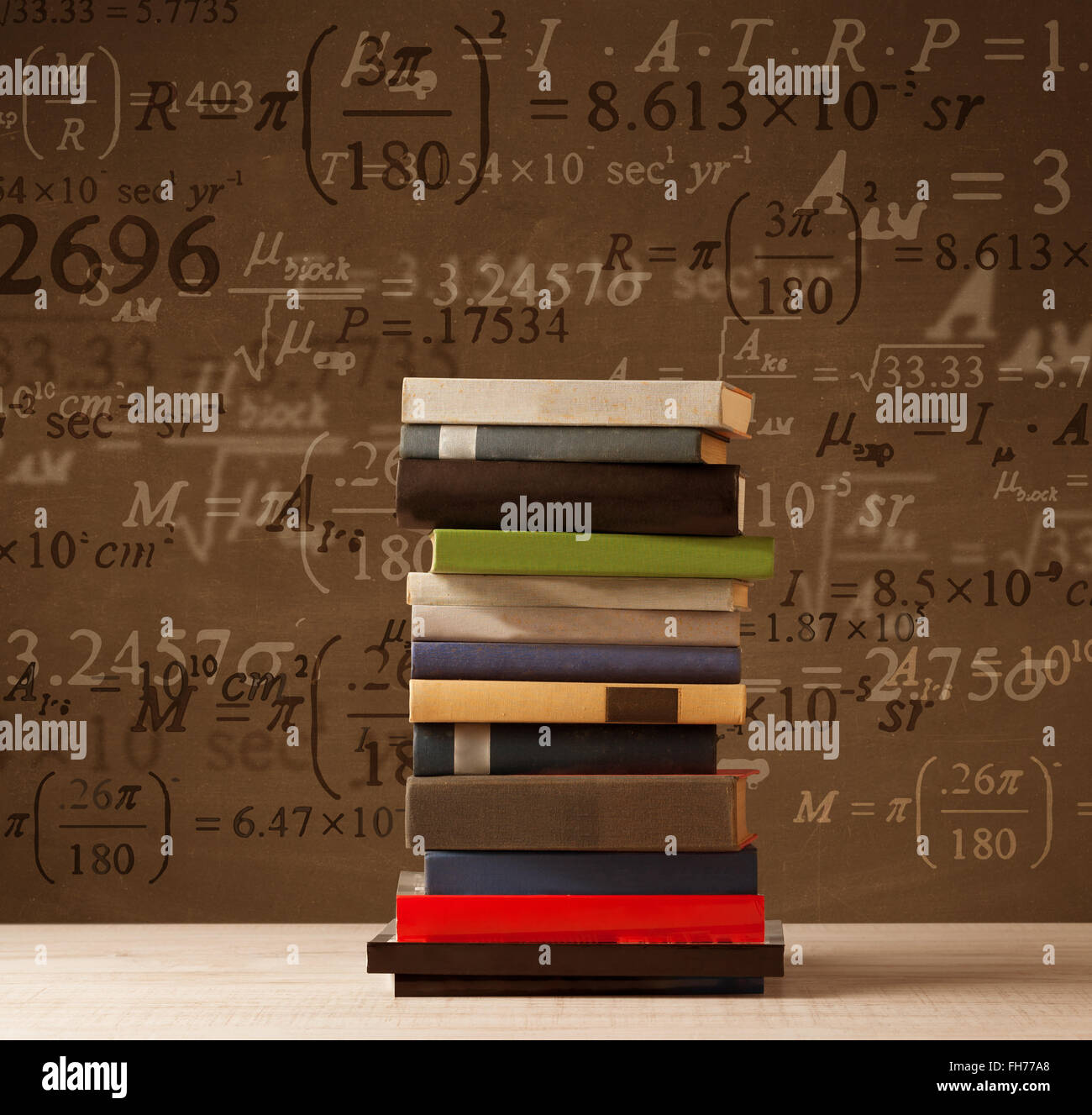 Books on vintage background with math formulas Stock Photo - Alamy