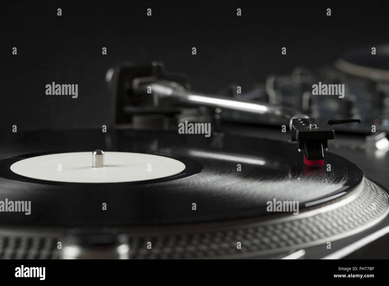 Turntable playing vinyl close up with needle on the record Stock Photo ...