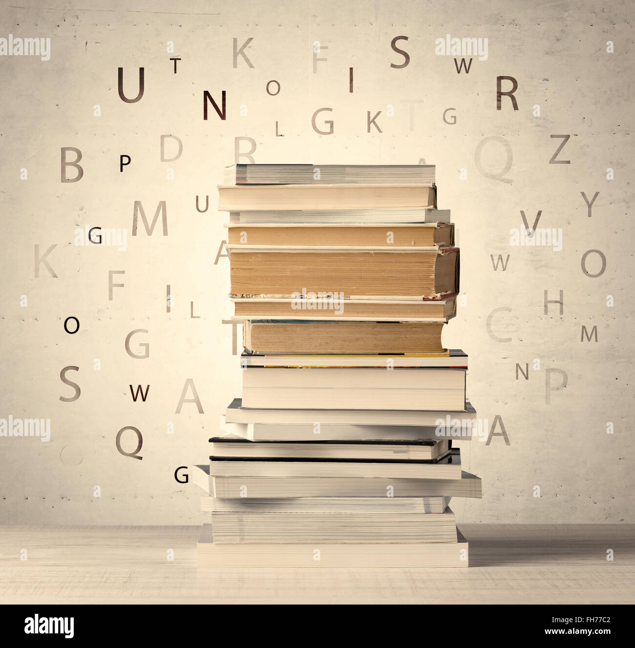 Books with flying letters on vintage background Stock Photo - Alamy