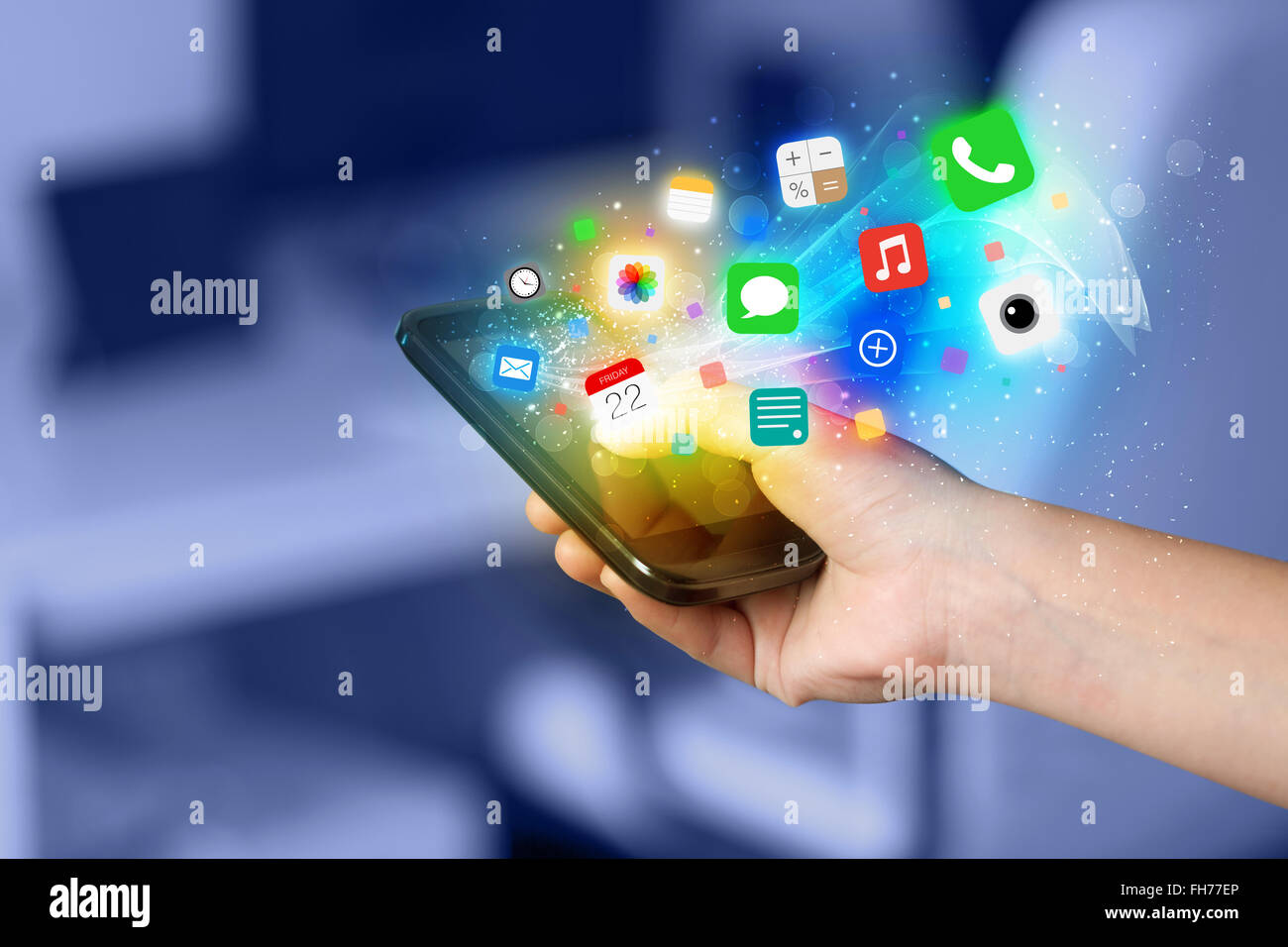 Hand holding smartphone with colorful app icons Stock Photo - Alamy