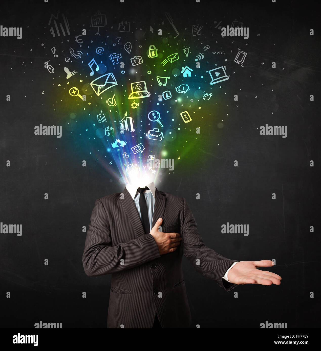 Business man with glowing media icons exploding head Stock Photo - Alamy