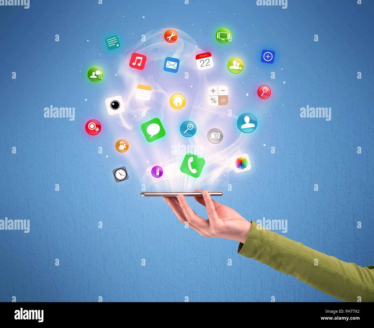 Hand holding tablet phone with app icons Stock Photo - Alamy