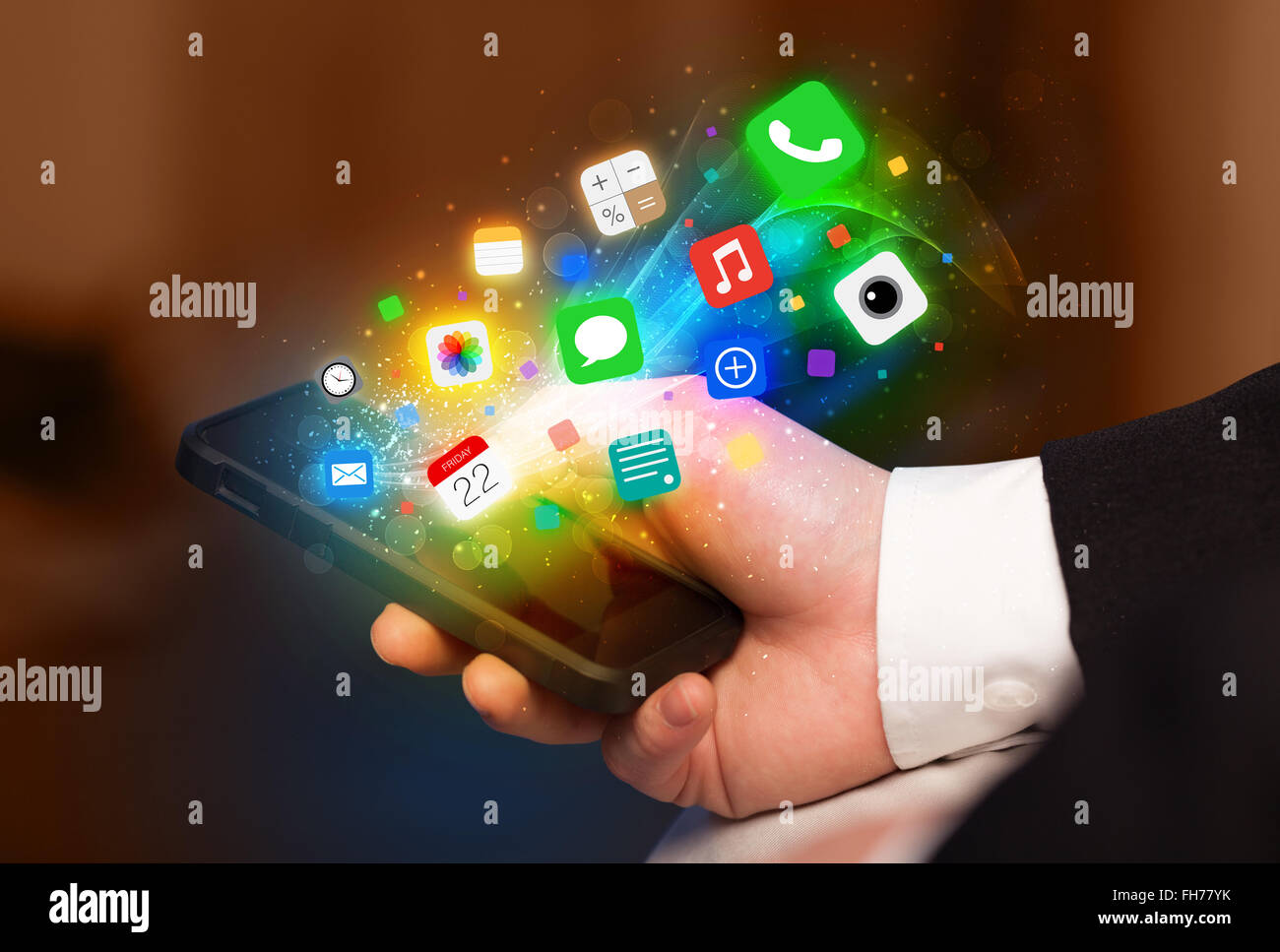 Hand holding smartphone with colorful app icons Stock Photo - Alamy