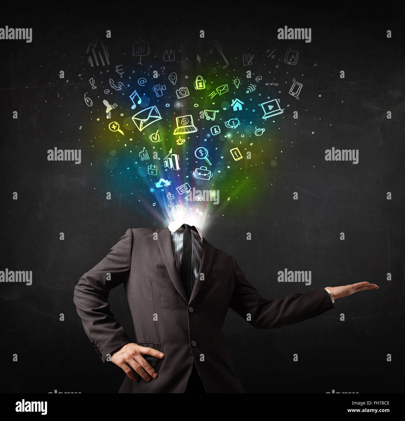 Business man with glowing media icons exploding head Stock Photo - Alamy