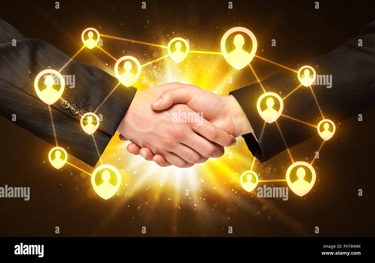 Social netwok connection handshake Stock Photo - Alamy