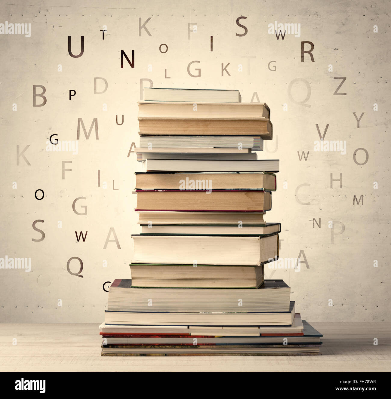 Books with flying letters on vintage background Stock Photo - Alamy