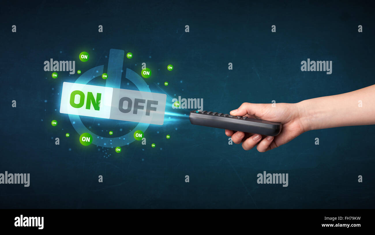 Hand with remote control and on-off signals Stock Photo - Alamy
