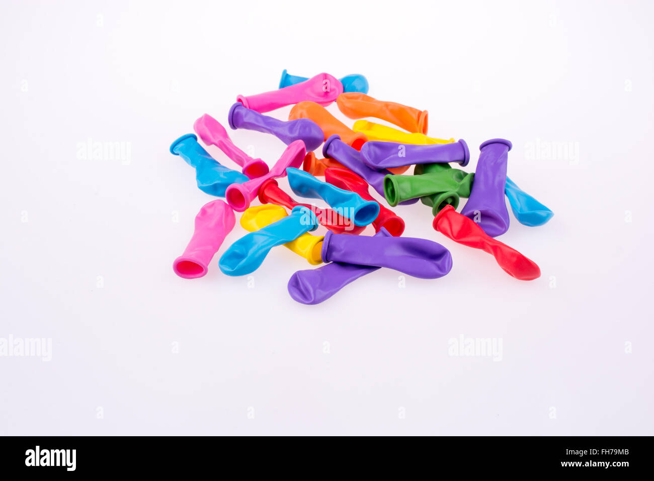 Heap Of Colorful Empty Balloons on a white backgorund Stock Photo - Alamy