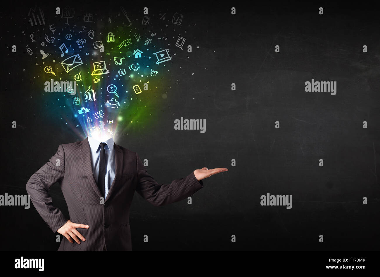 Business man with glowing media icons exploding head Stock Photo - Alamy