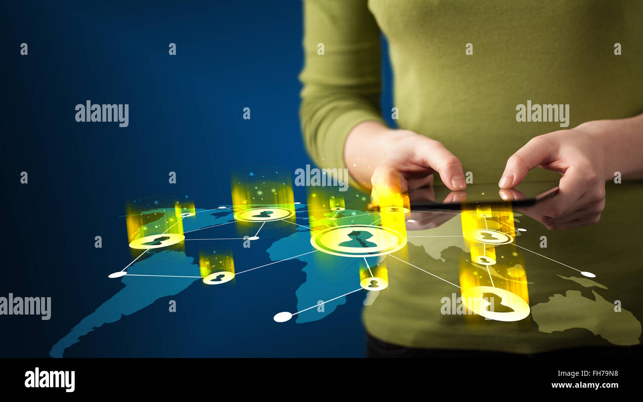 Hand holding tablet device with social network map Stock Photo - Alamy