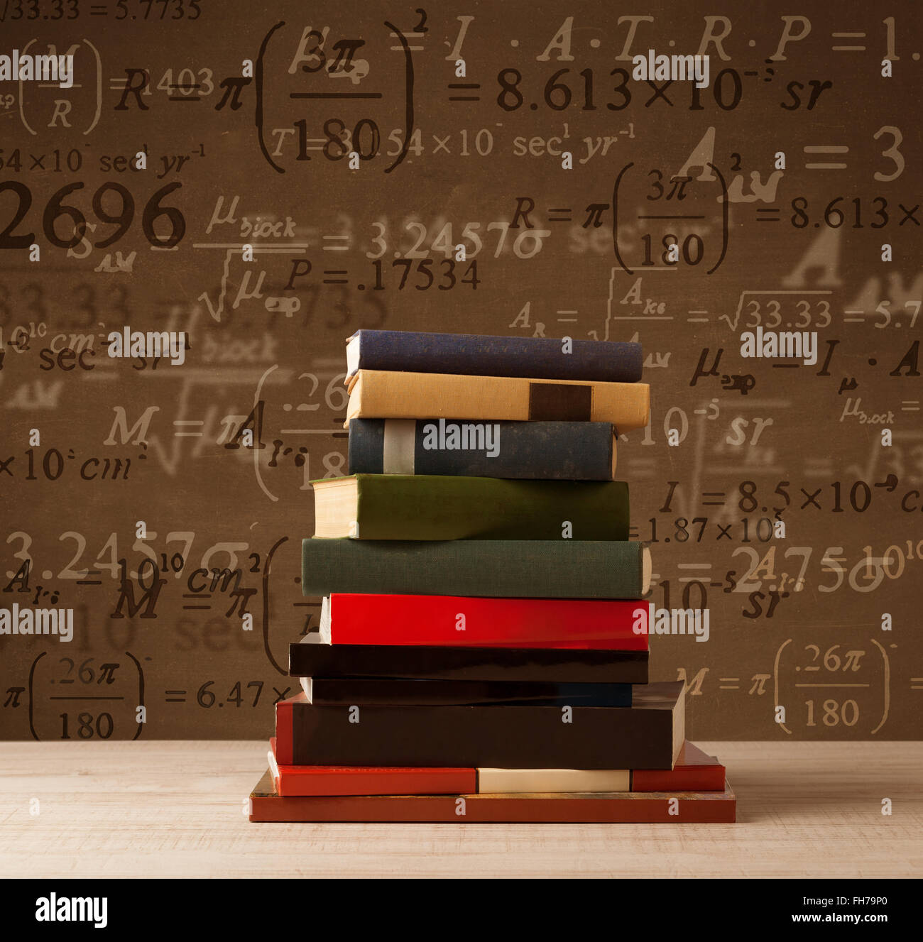 Books on vintage background with math formulas Stock Photo - Alamy
