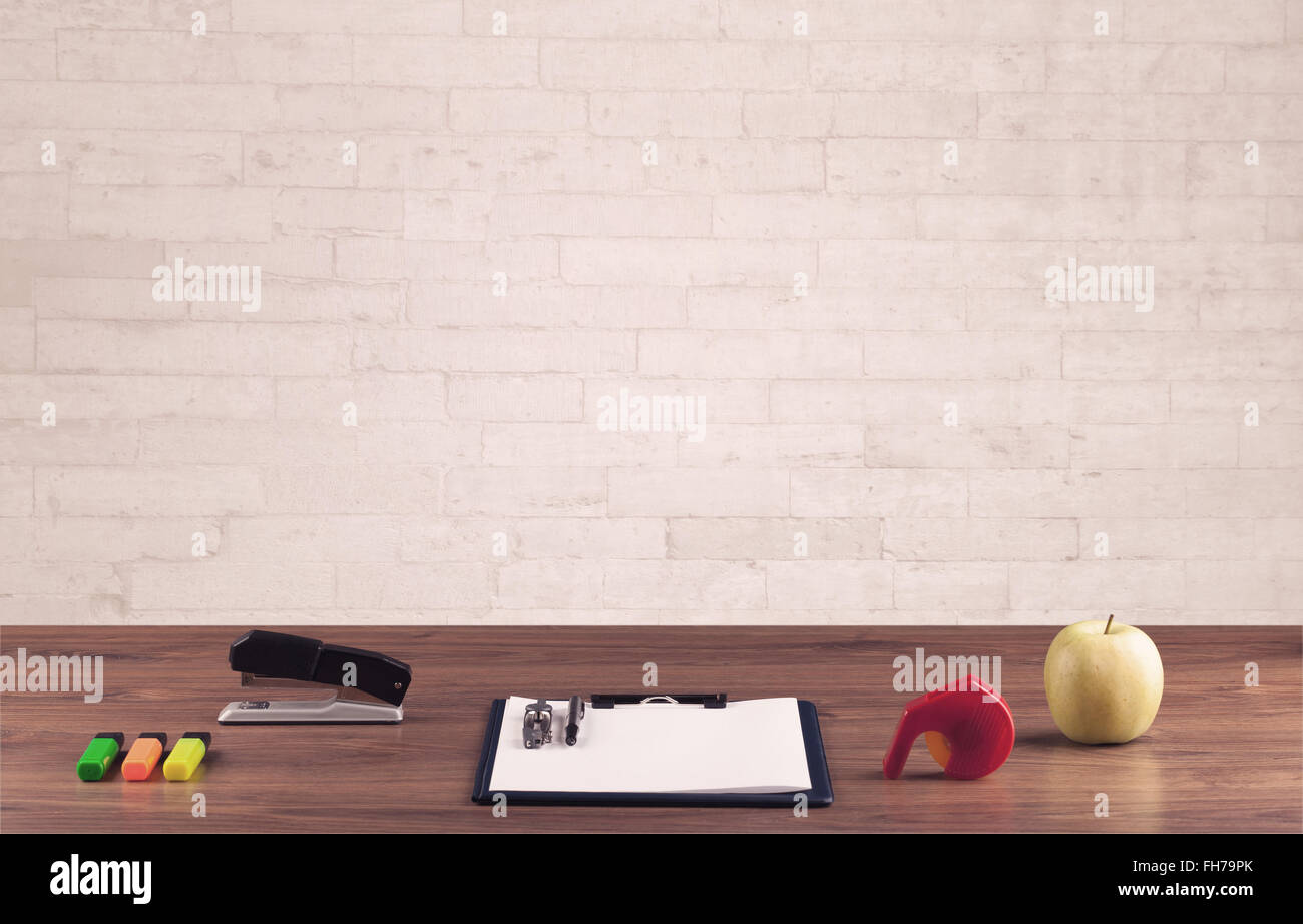 Office desk closeup with white brick wall Stock Photo - Alamy