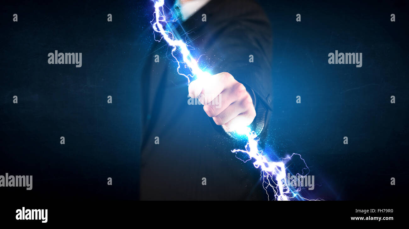 Business man holding electricity light bolt in his hands Stock Photo ...