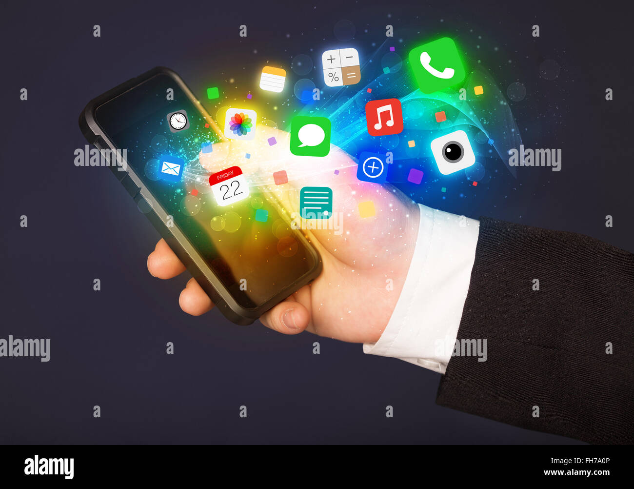 Hand holding smartphone with colorful app icons Stock Photo - Alamy